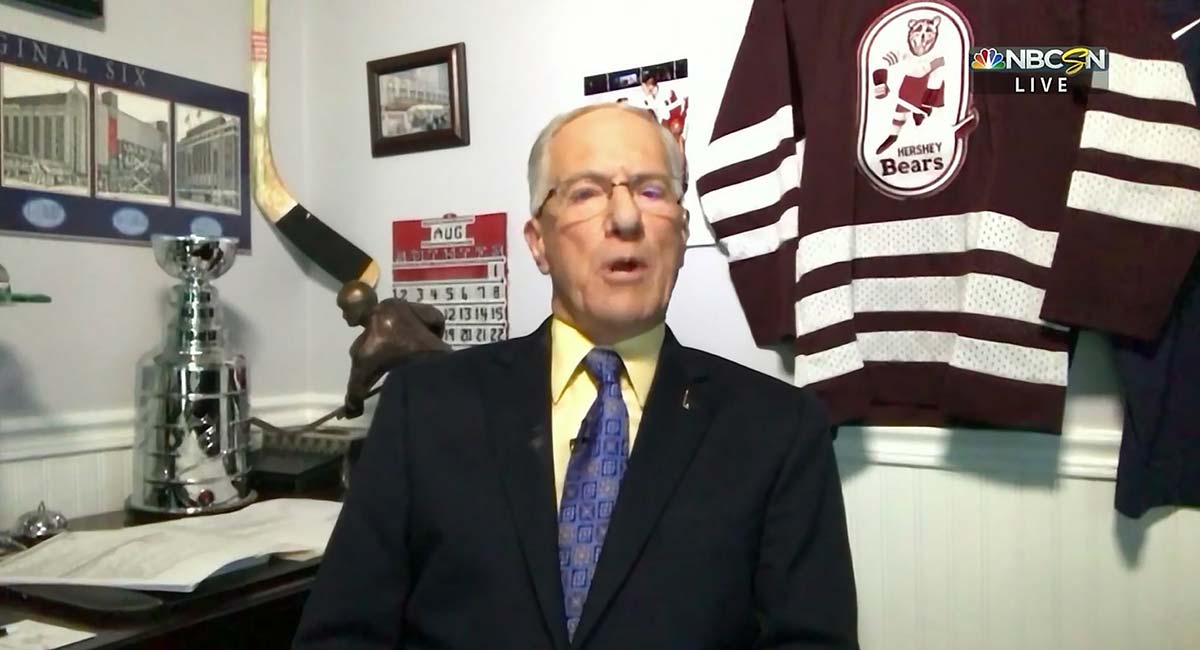 Mike Emrick shows off Hershey Bears jersey during national telecast