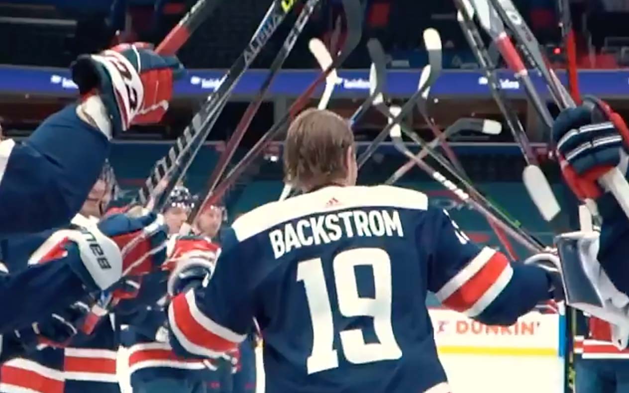 Capitals players form stick tunnel for Nicklas Backstrom as he makes ...