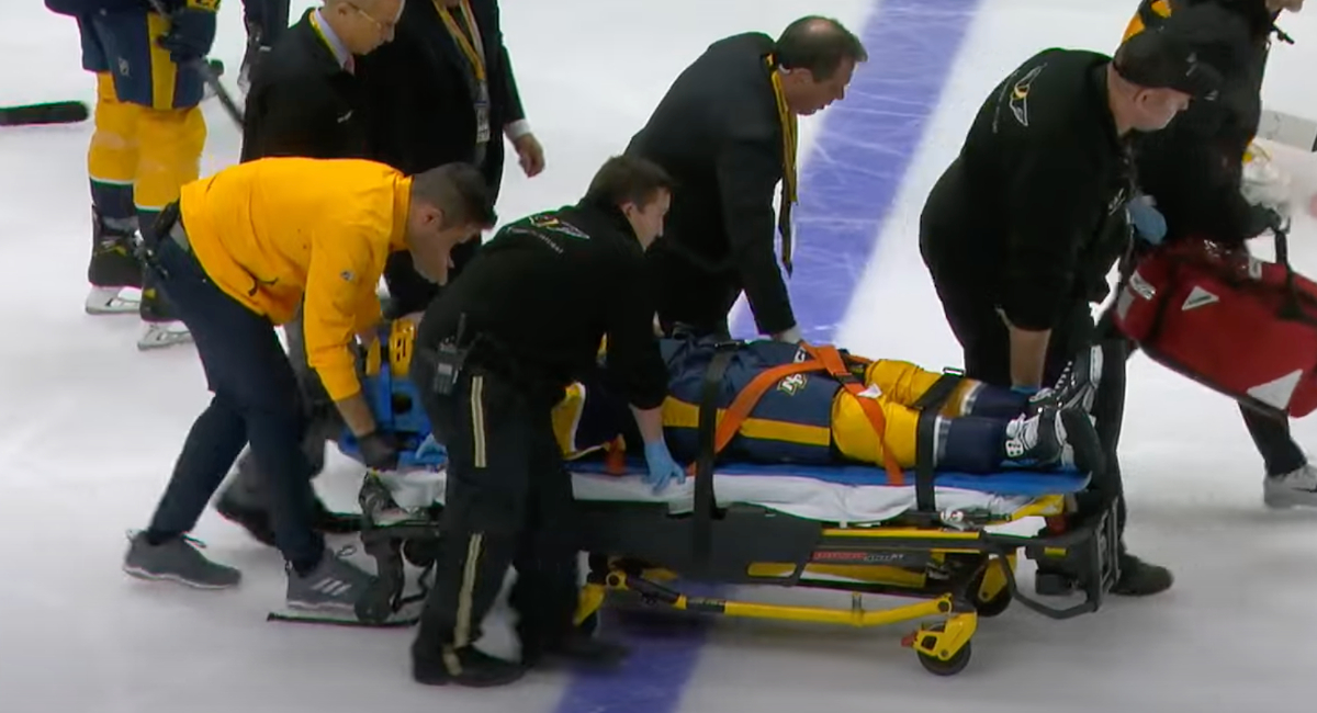 Predators defenseman Mark Borowiecki stretchered off ice after taking ...