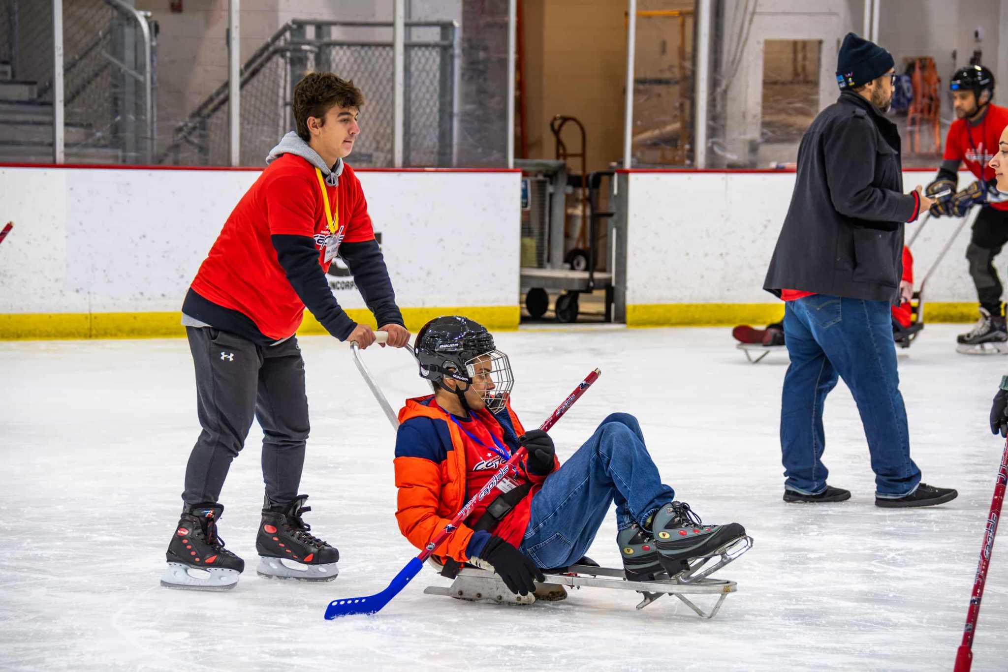 Charlie Lindgren and Nic Dowd help host adaptive skate for children ...