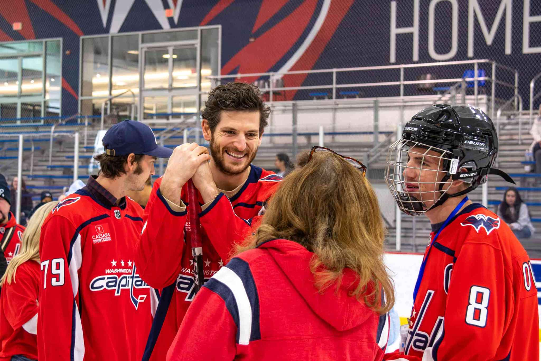 Charlie Lindgren and Nic Dowd help host adaptive skate for children with disabilities