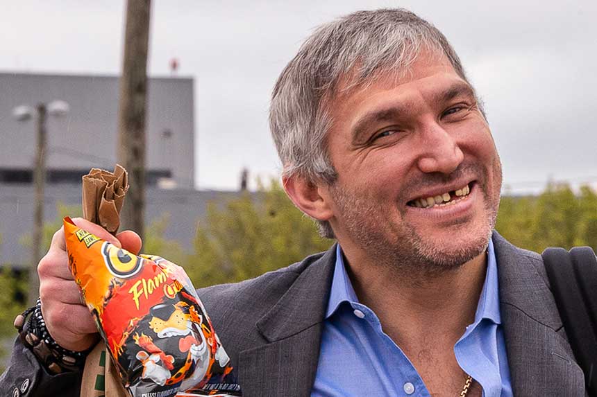 Alex Ovechkin proudly takes flight to Buffalo beardless and with bag of ...